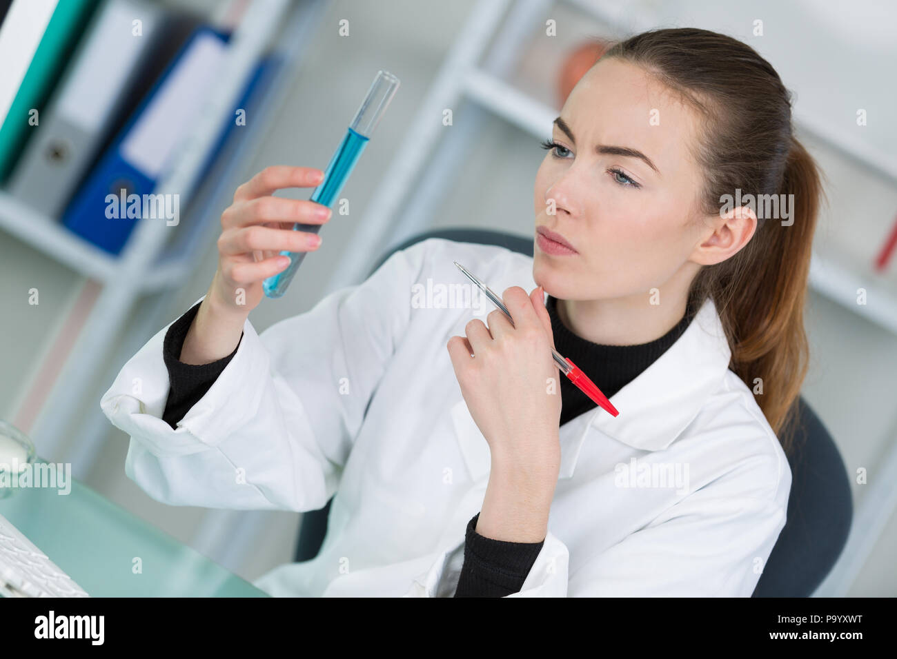 female lab chemist full test tube with long pipette Stock Photo - Alamy