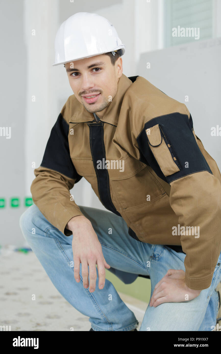 worker posing and smiling Stock Photo - Alamy