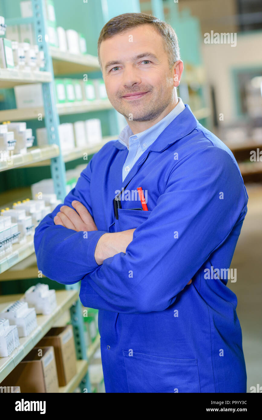 Portrait of man next to racking Stock Photo - Alamy