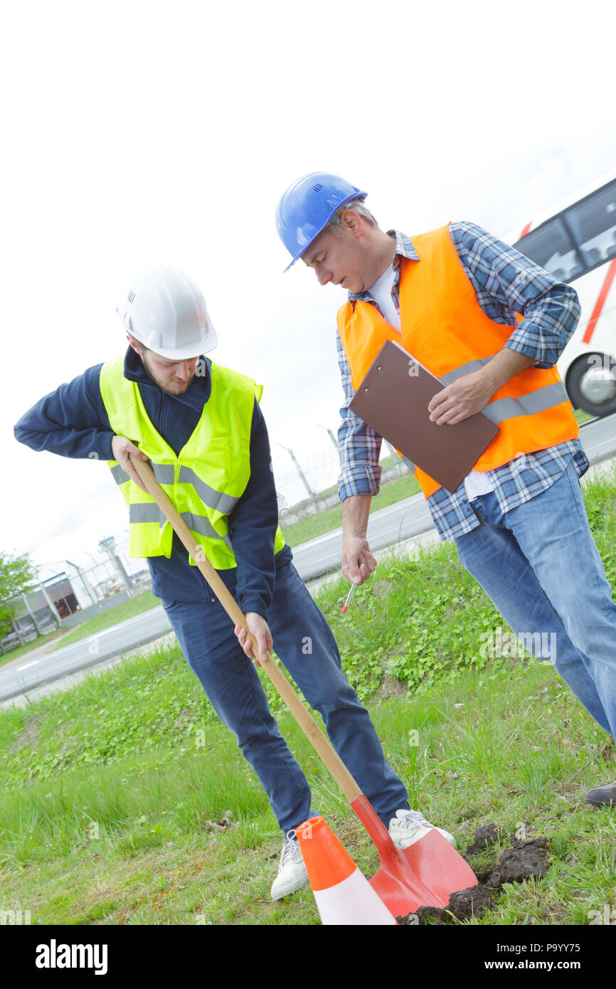 Builder using shovel in hi-res stock photography and images - Alamy