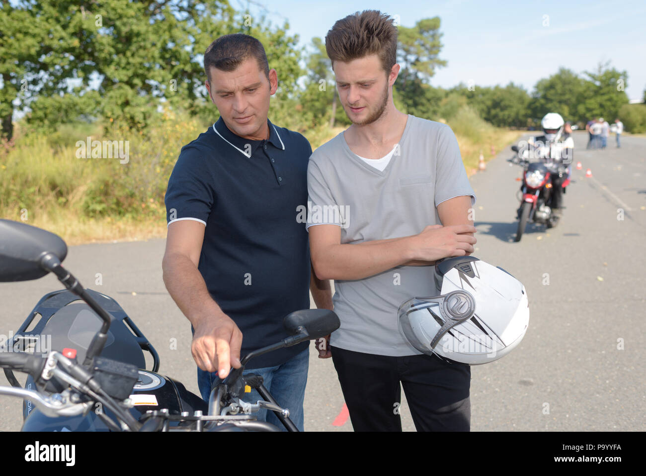 teenage boy with motorbike and driving license Stock Photo - Alamy