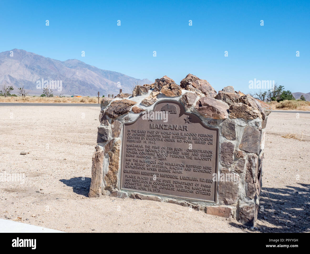 Manzanar memorial plaque, Eastern Sierra mountains in the distance ...