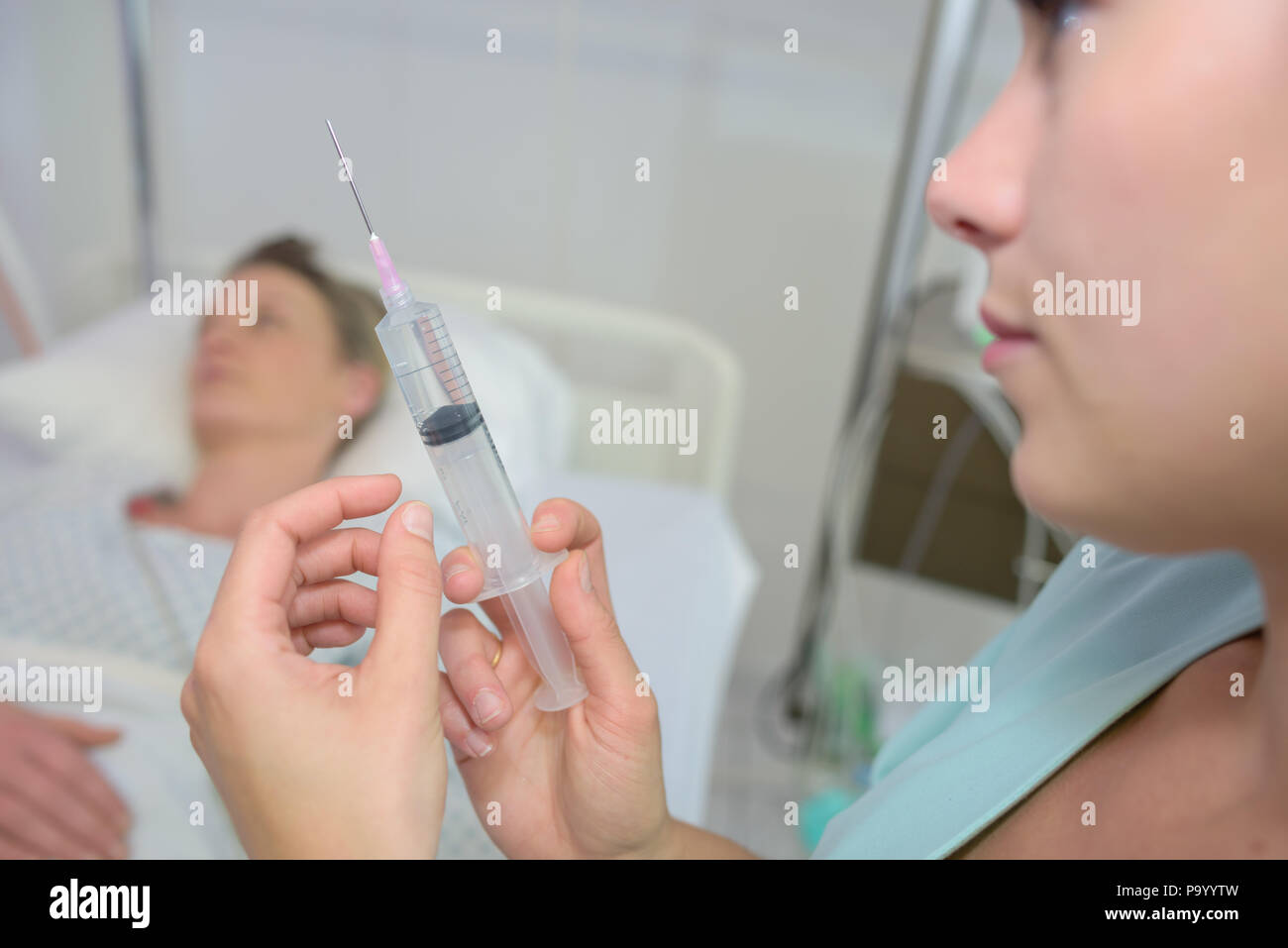 Woman hospital gown injection hi-res stock photography and images - Alamy