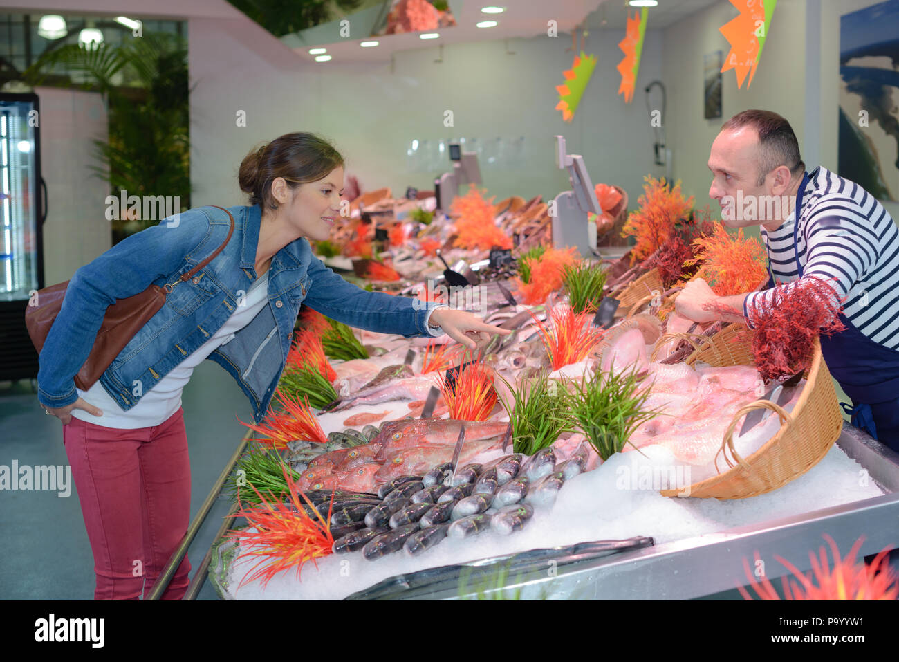 Woman in 40s eating fish hi-res stock photography and images - Alamy