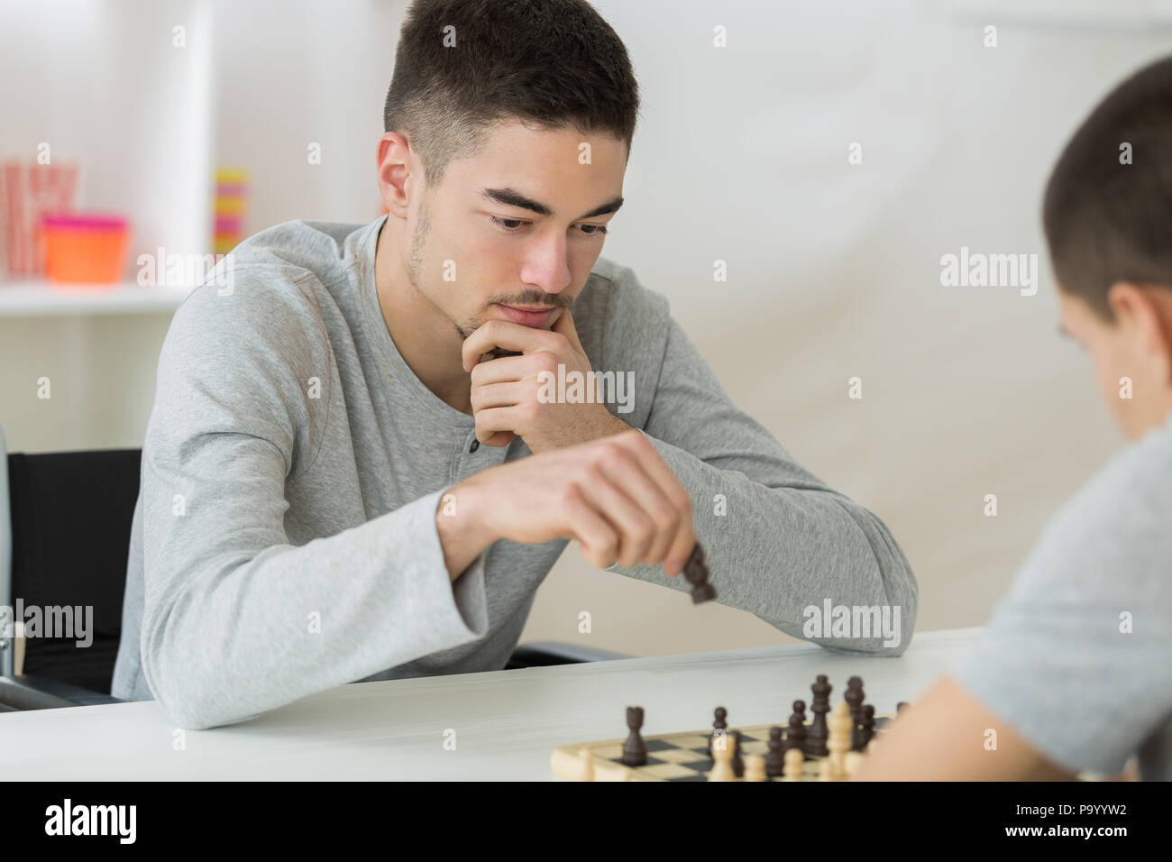 two friends playing chess Stock Photo - Alamy