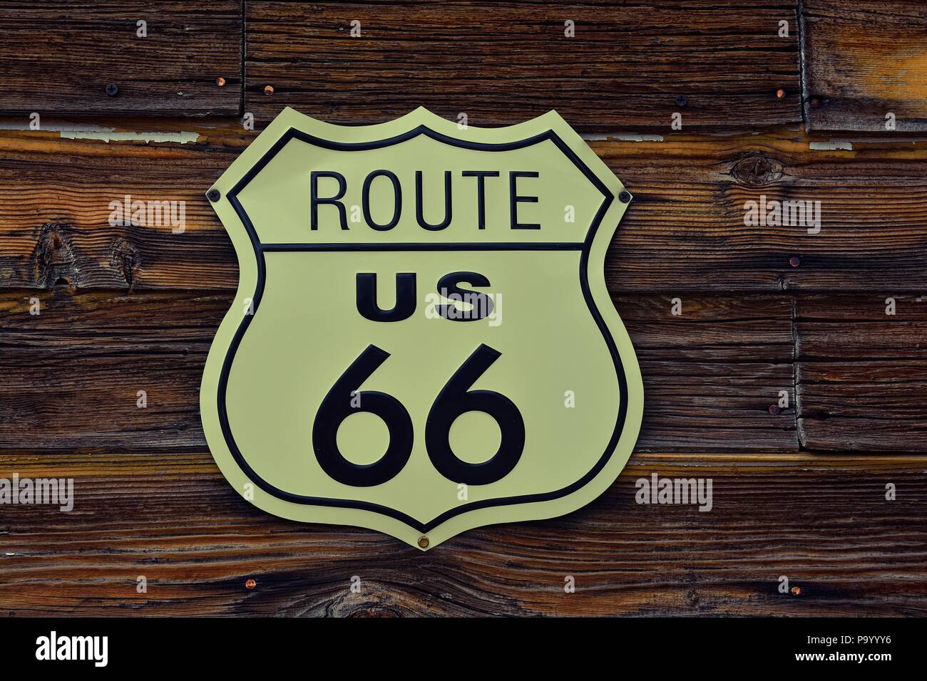Historic U.S. old Route 66 sign with wooden background Stock Photo - Alamy