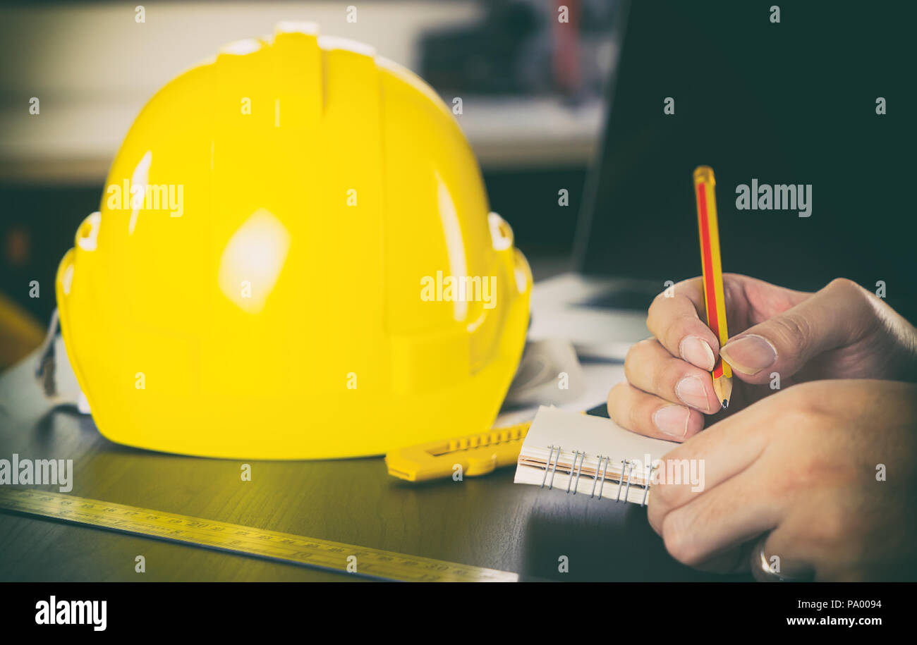 Engineer construction worker is taking note in office Stock Photo - Alamy