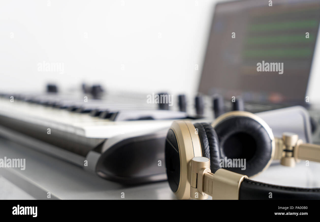 Golden Music Studio headphone with Computer music producing equipment ...