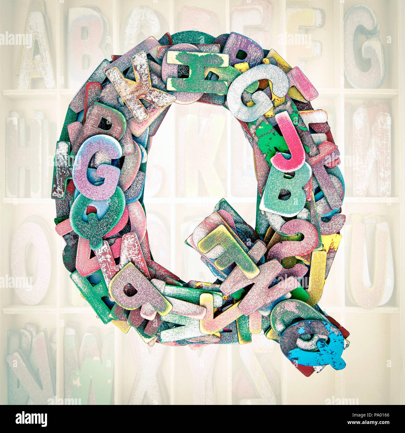 lots of small wooden letters to make up the letter Q Stock Photo - Alamy