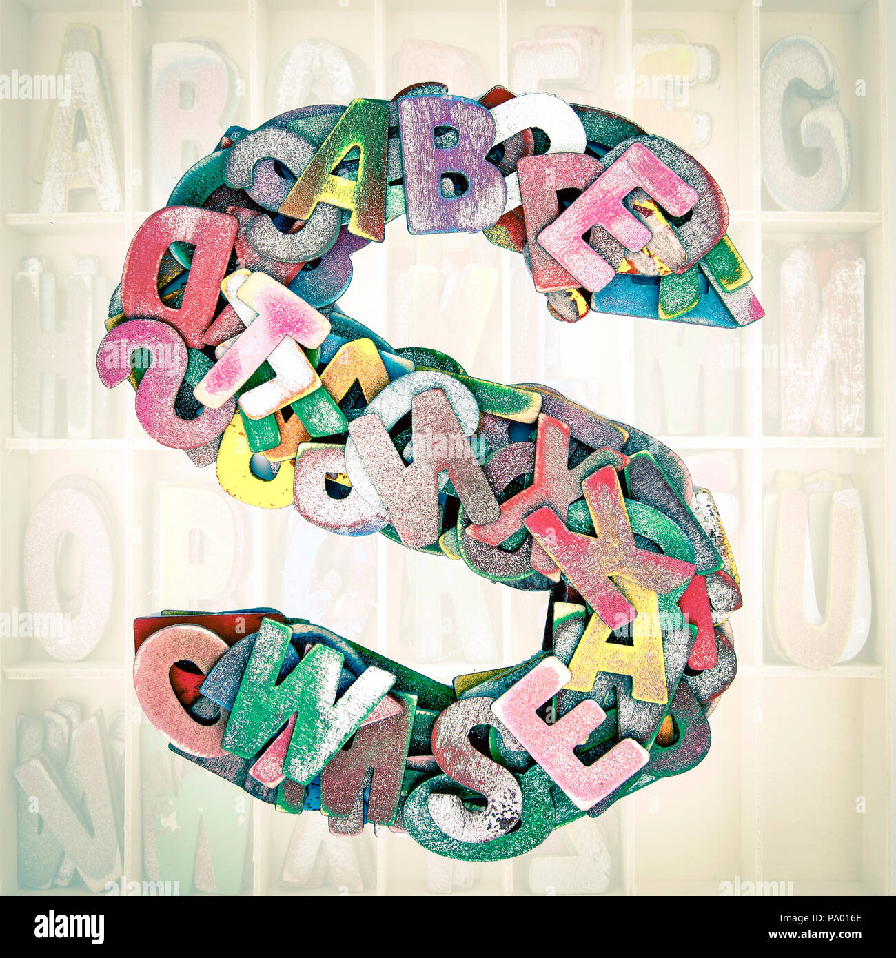 lots of small wooden letters to make up the letter S Stock Photo - Alamy