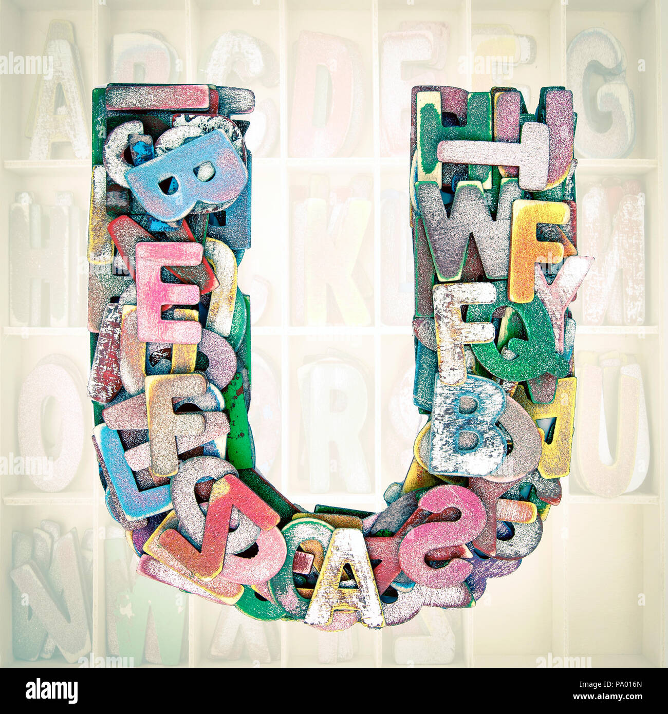 lots of small wooden letters to make up the letter U Stock Photo - Alamy