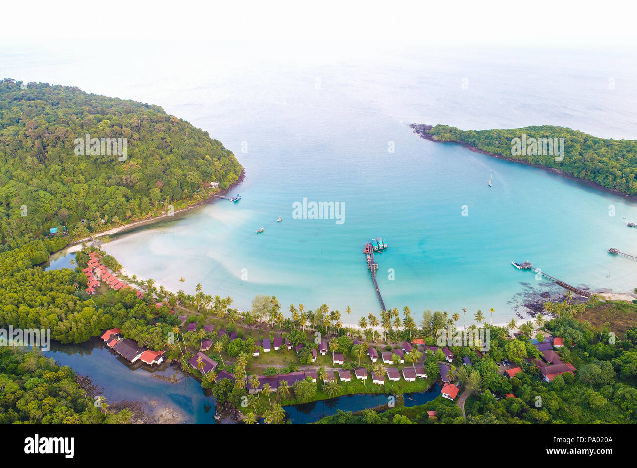 Seashore blue ocean with green tree forest aerial view Stock Photo - Alamy