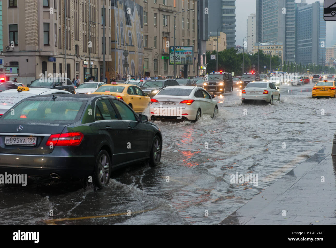 MOSCOW, RUSSIA - JULY 19, 2018: Heavy rain flooded the Moscow street ...