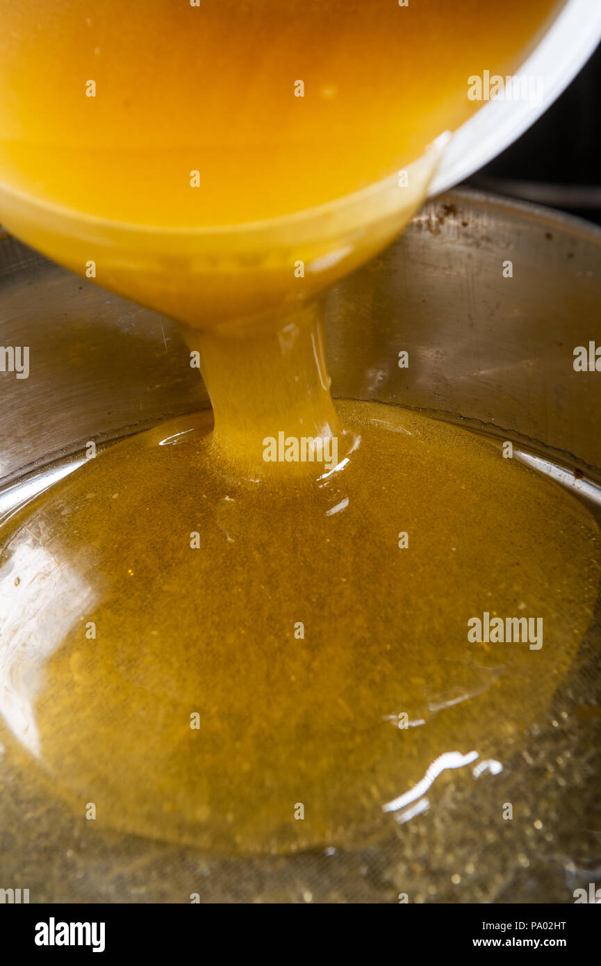 Strain the poured honey through a sieve. How to Harvest Honey ...