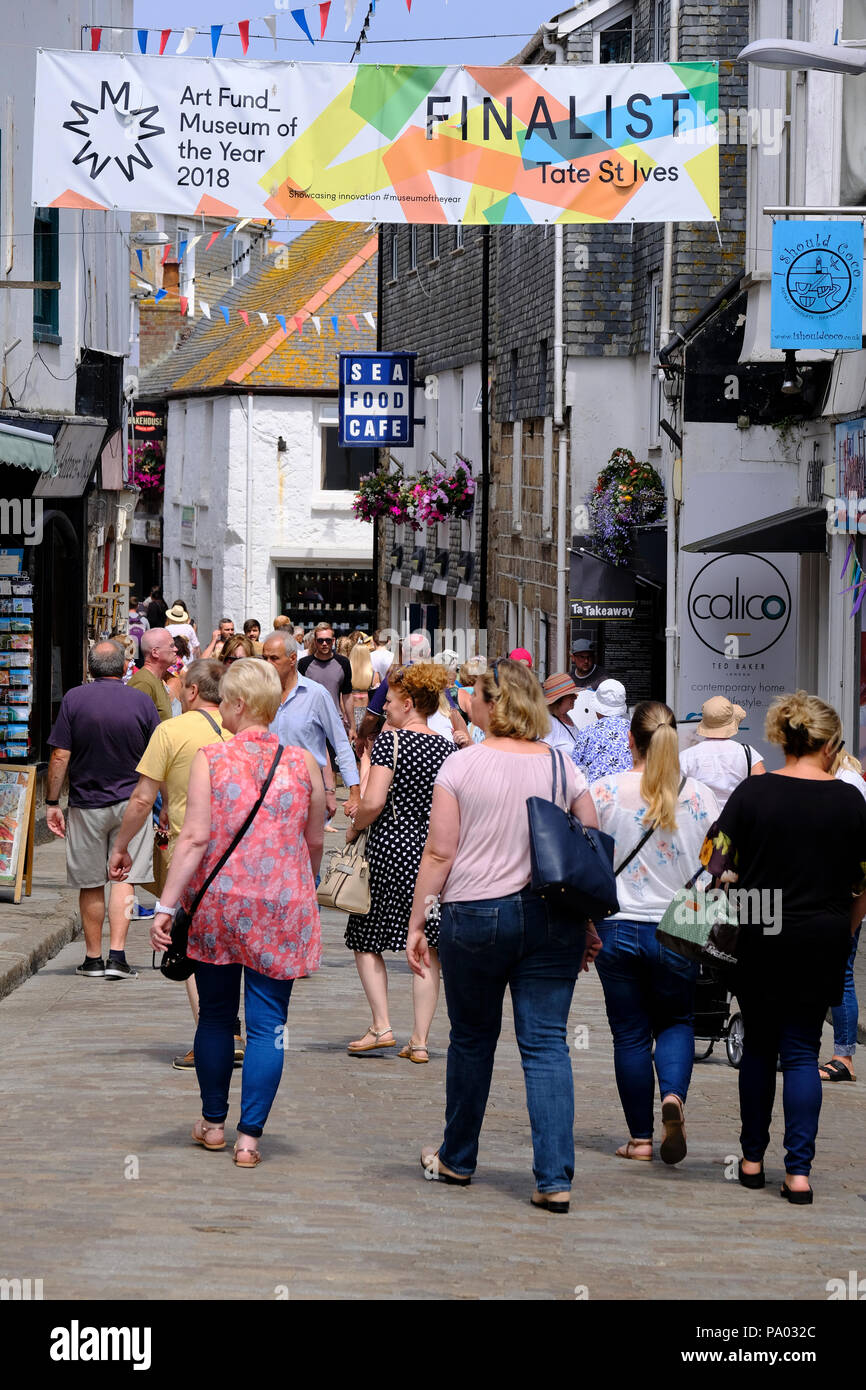 Visitors along Fore Street in the centre of St Ives in Cornwall Stock ...