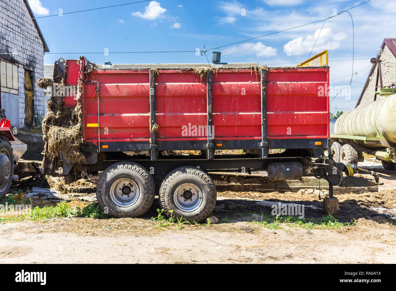 Agricultural machinery on a dairy farm. Trailer-distributor of organic ...