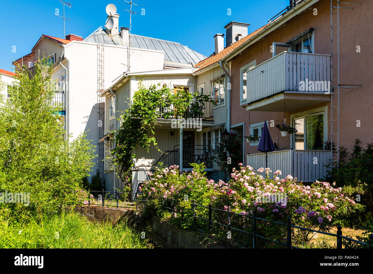 Urban back yard with flowers and shrubbery. Location Gamleby in Sweden ...