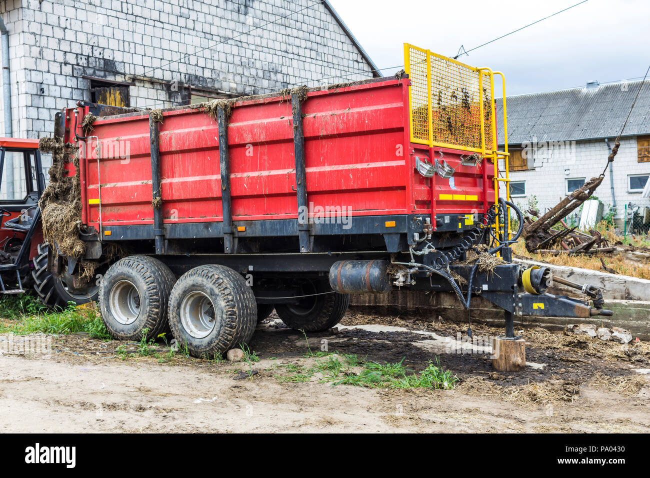 Agricultural machinery on a dairy farm. Trailer-distributor of organic ...