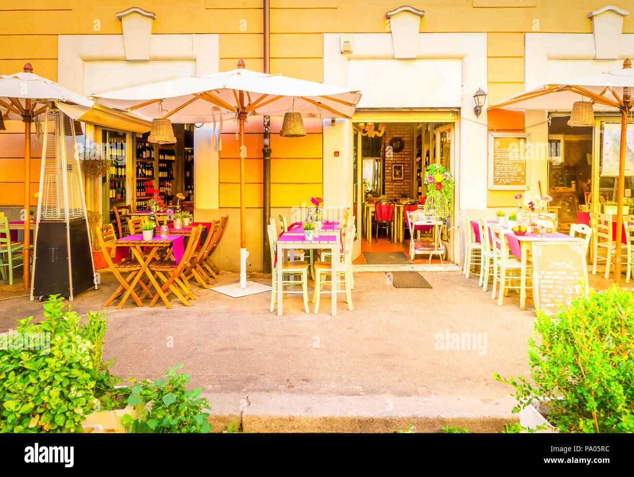 typical italian street cafe in Trastevere with green plants, Rome ...