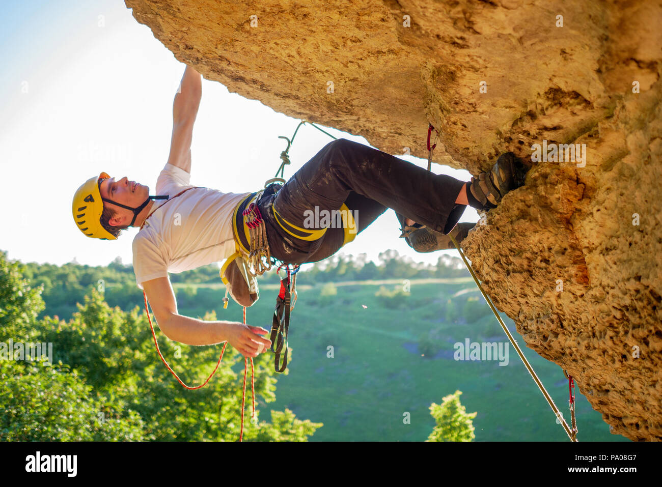 Caucasian man climbing trees sports hi-res stock photography and images ...