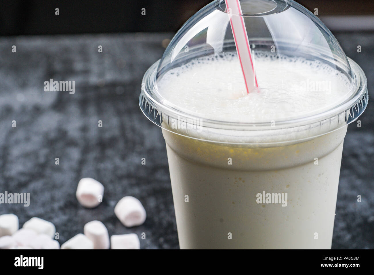 Milkshake clear plastic Cup Stock Photo - Alamy