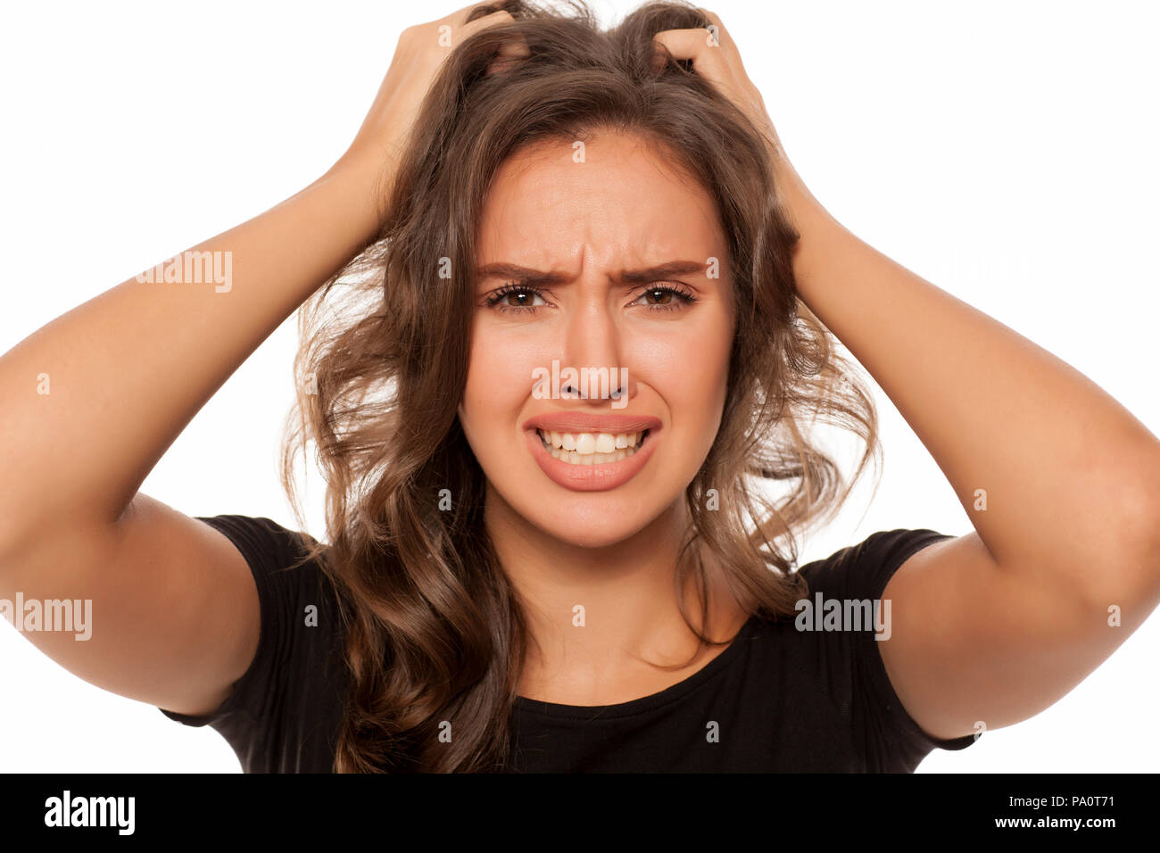 Beautiful young woman has an itch in her hair on white background Stock ...