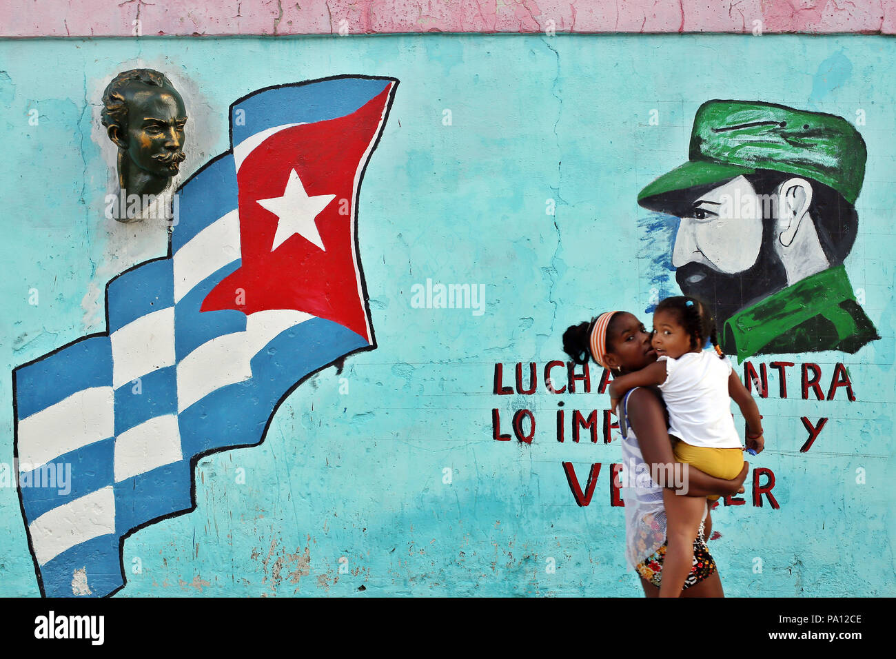 La Habana, La Habana, Cuba. 18th July, 2018. Two girls walk next to ...