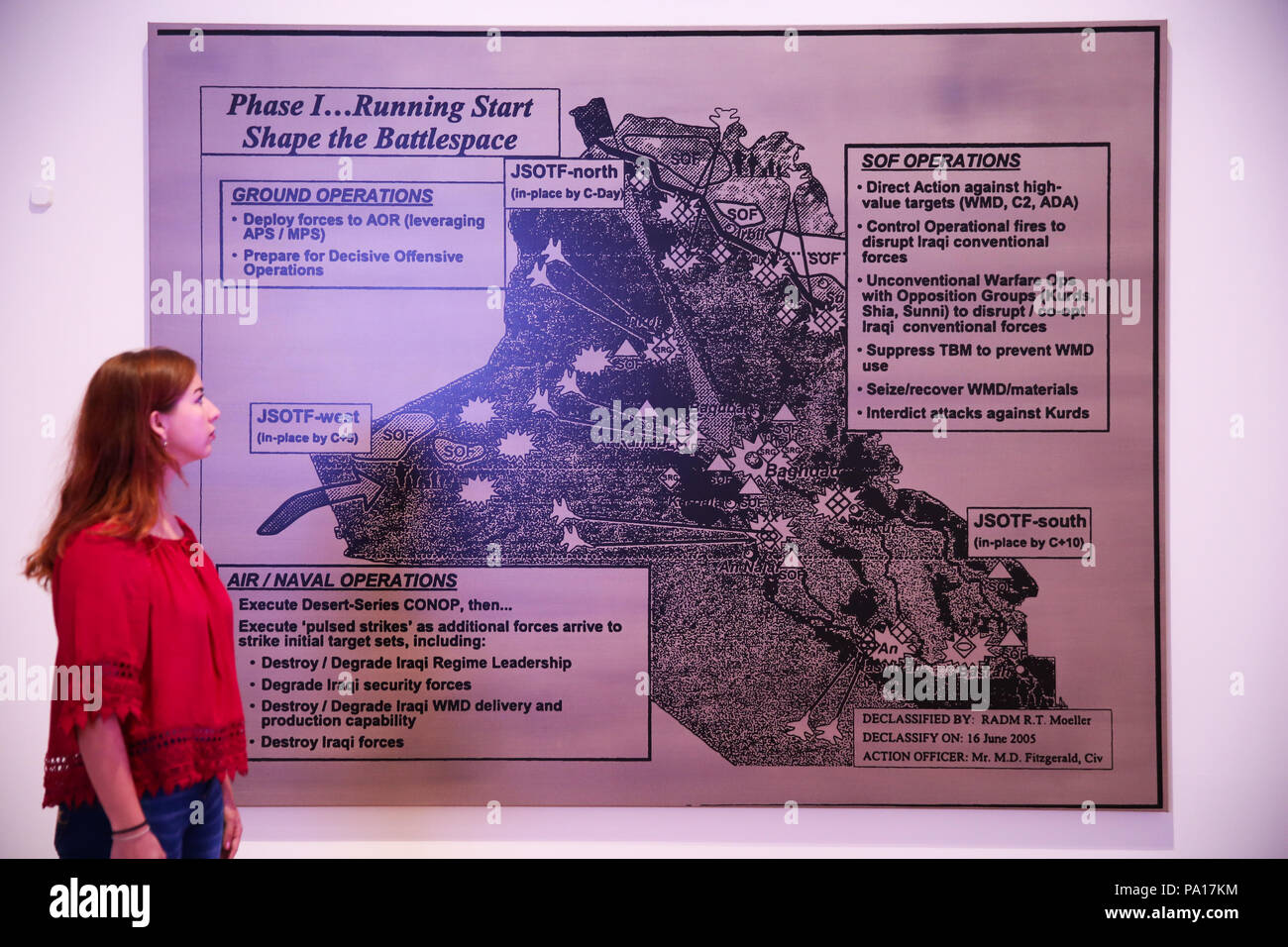 Tate Modern. London. UK 20 July 2018 - A staff member looks at Jenny ...