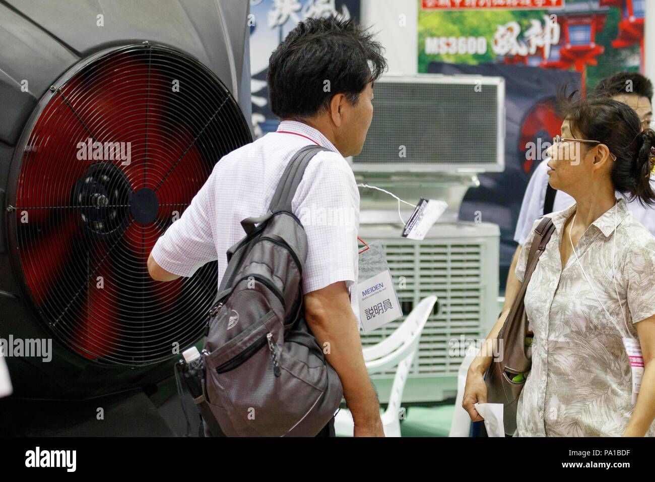 Cooling off in front of fan hi-res stock photography and images - Alamy