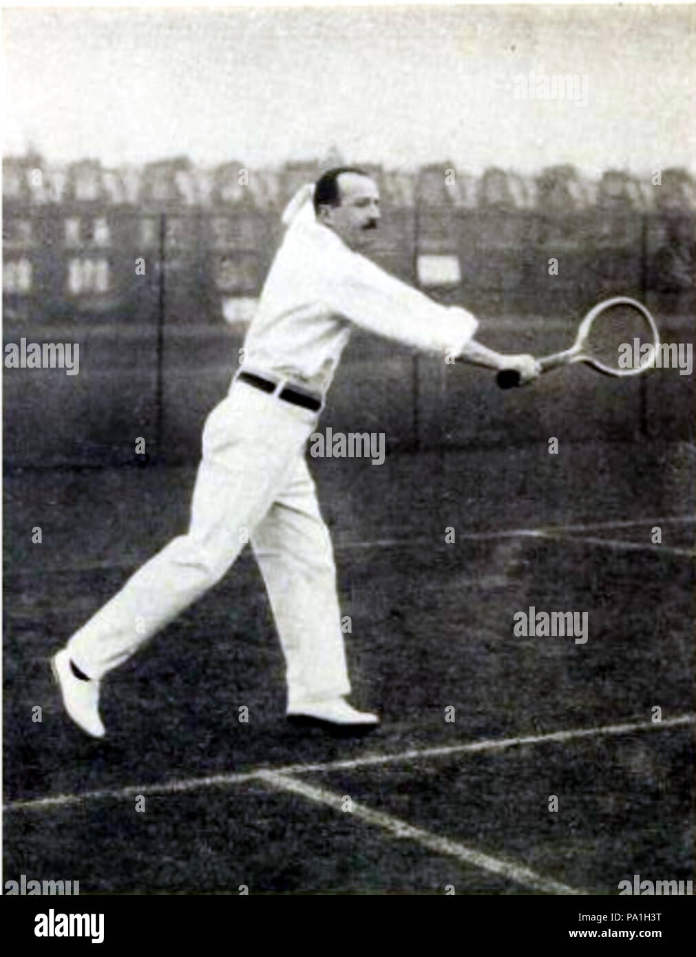 . English: George Aristides Caridia, English tennis player, making a ...
