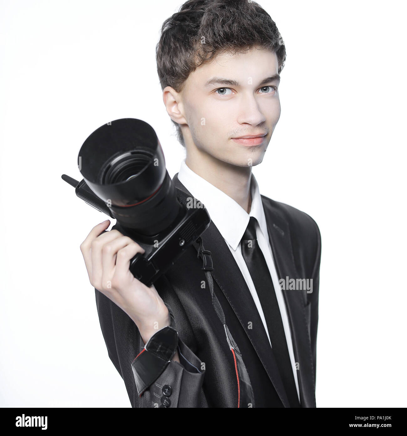 Portrait of young handsome photographer holding the camera Stock Photo ...