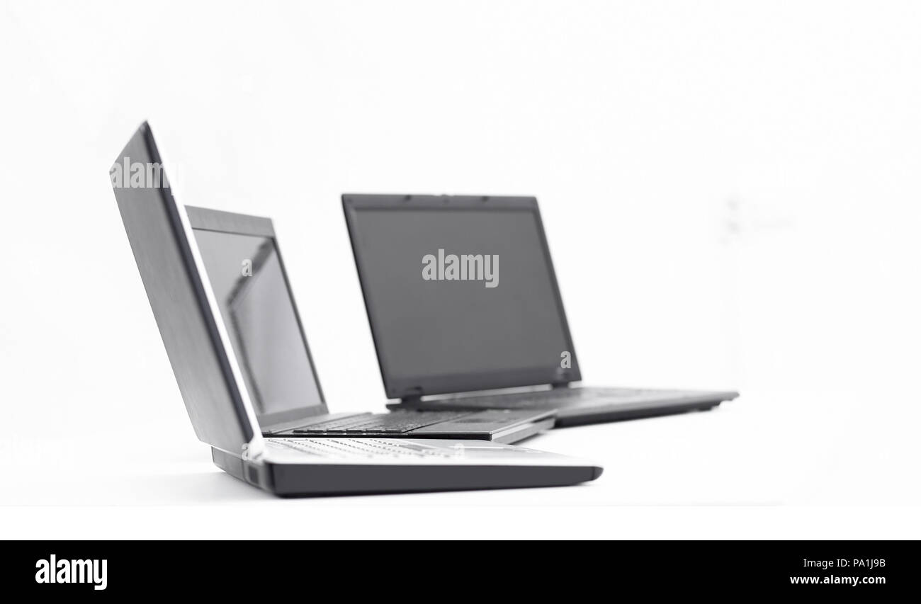 open laptop on the desktop in an empty office Stock Photo - Alamy