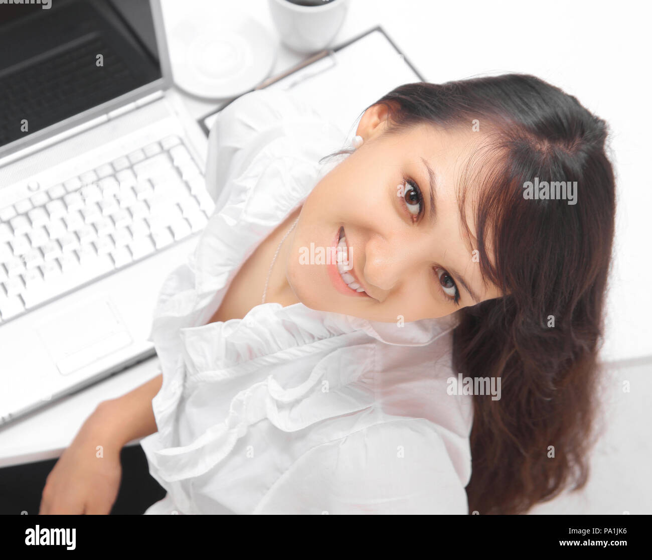 cute female assistant sitting at a Desk Stock Photo - Alamy