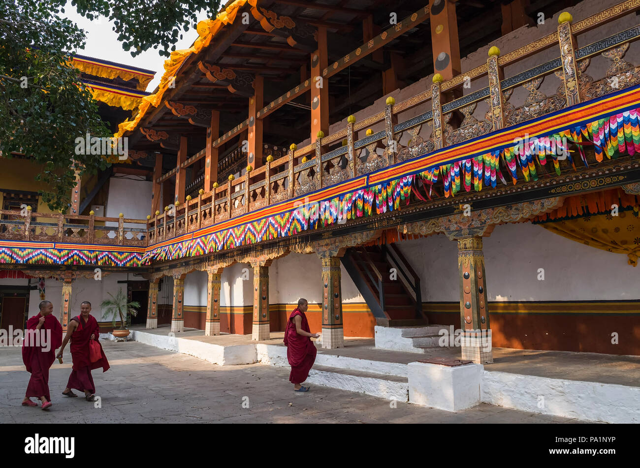 Punakha, Bhutan - April 10, 2016: Monks around the large white-washed ...