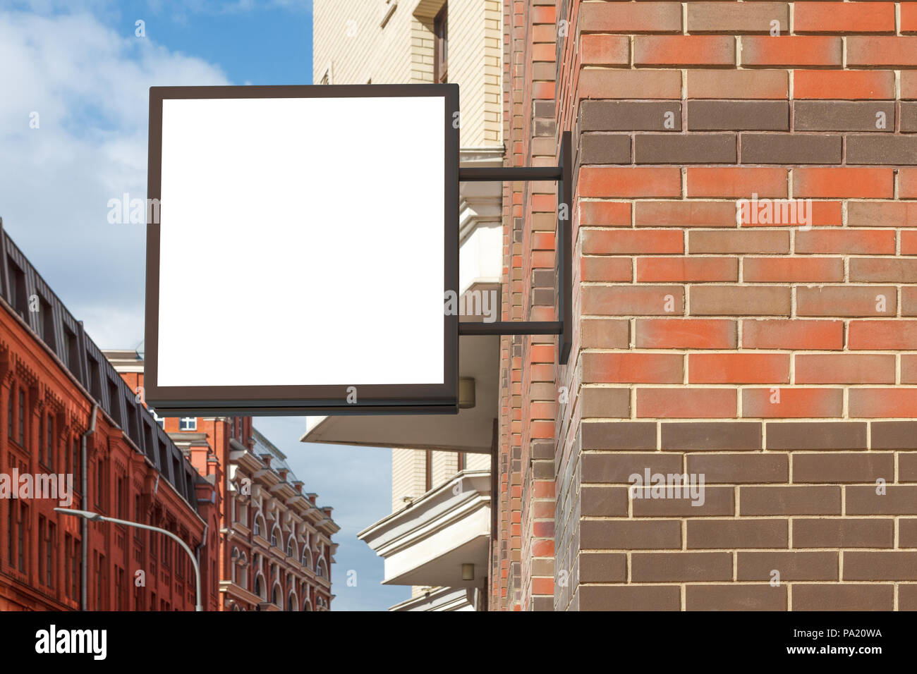 Blank square singboard on the brick wall Stock Photo - Alamy