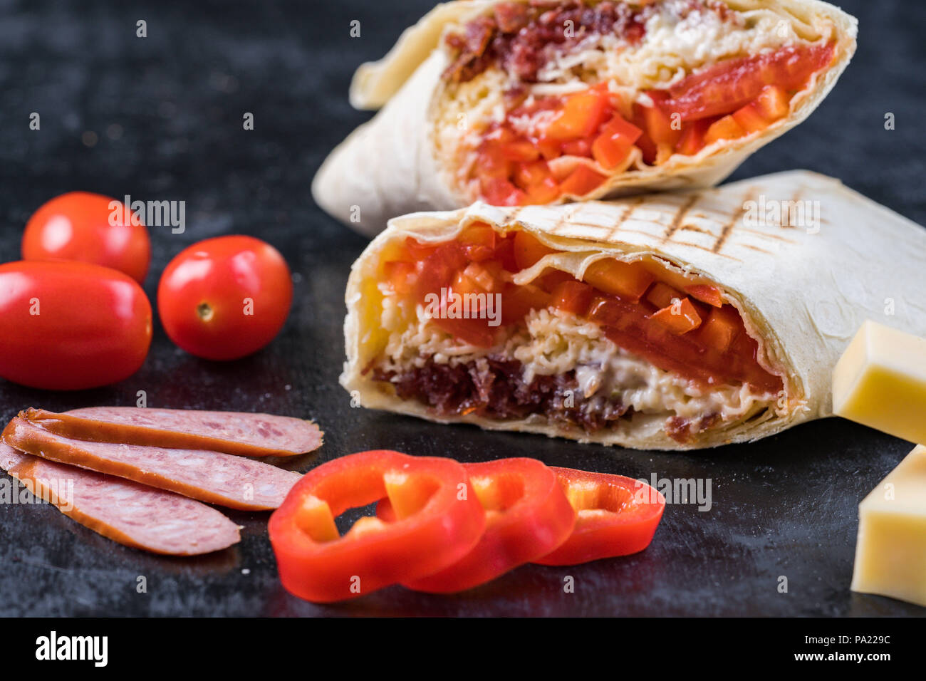 Delicious shawarma on a black background Stock Photo - Alamy