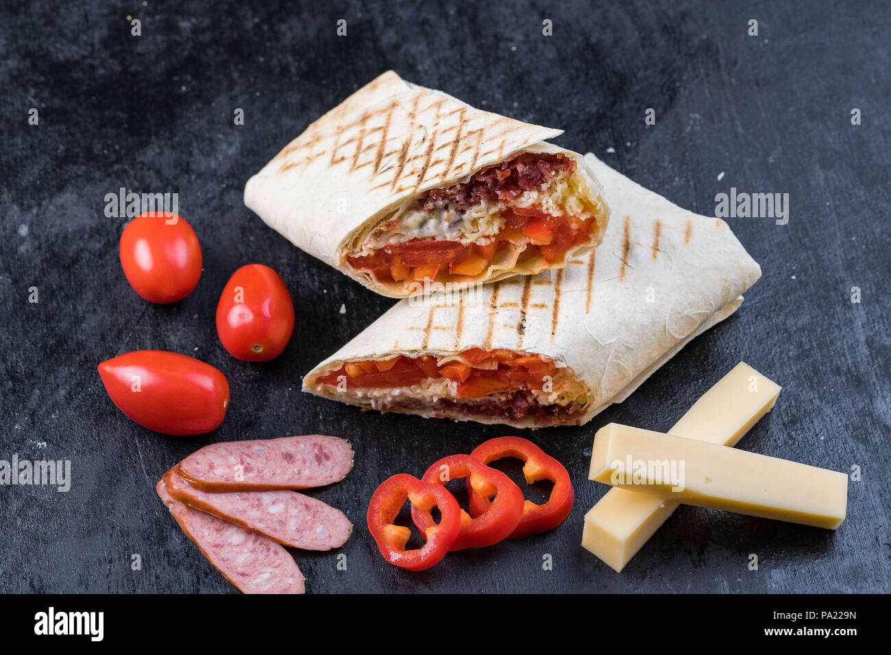Delicious shawarma on a black background Stock Photo - Alamy
