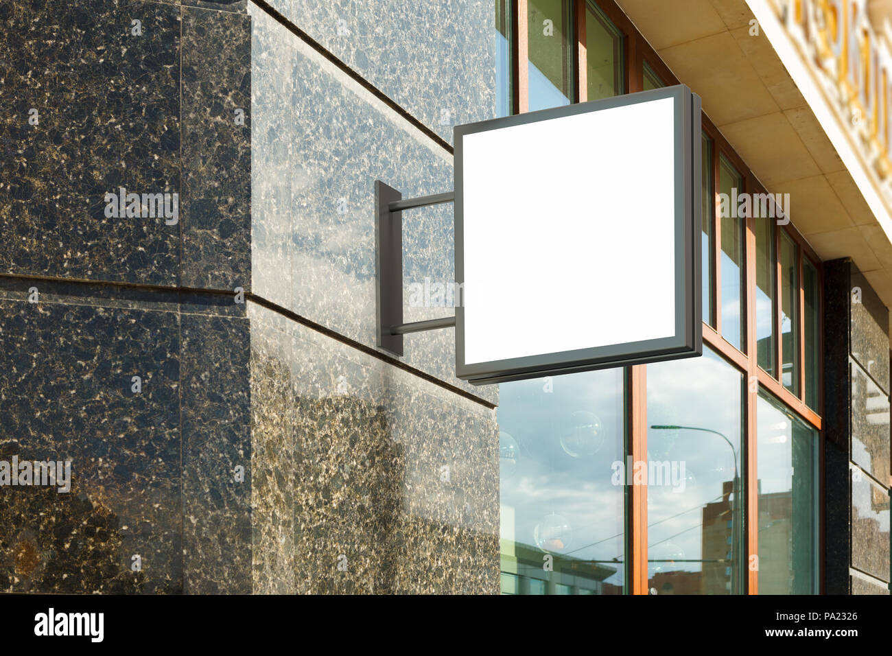 Blank square singboard on the granite wall Stock Photo - Alamy