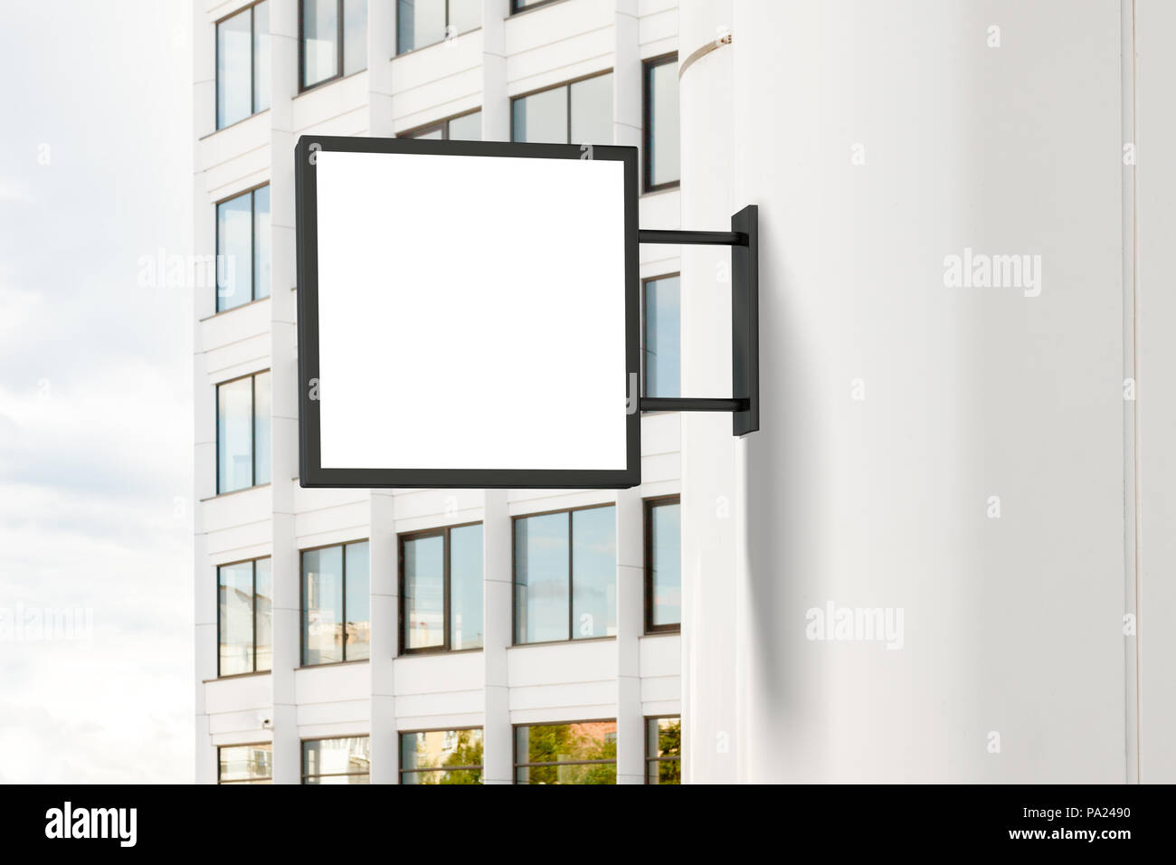 Blank square singboard on the white wall Stock Photo - Alamy