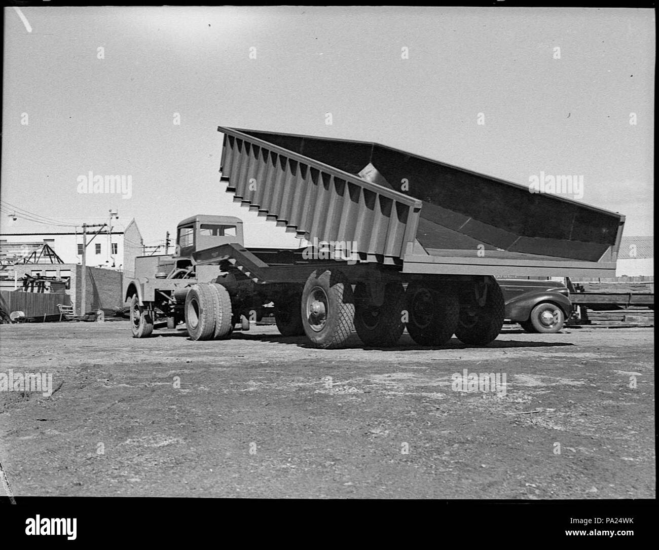 Workers on trailer in Black and White Stock Photos & Images - Alamy