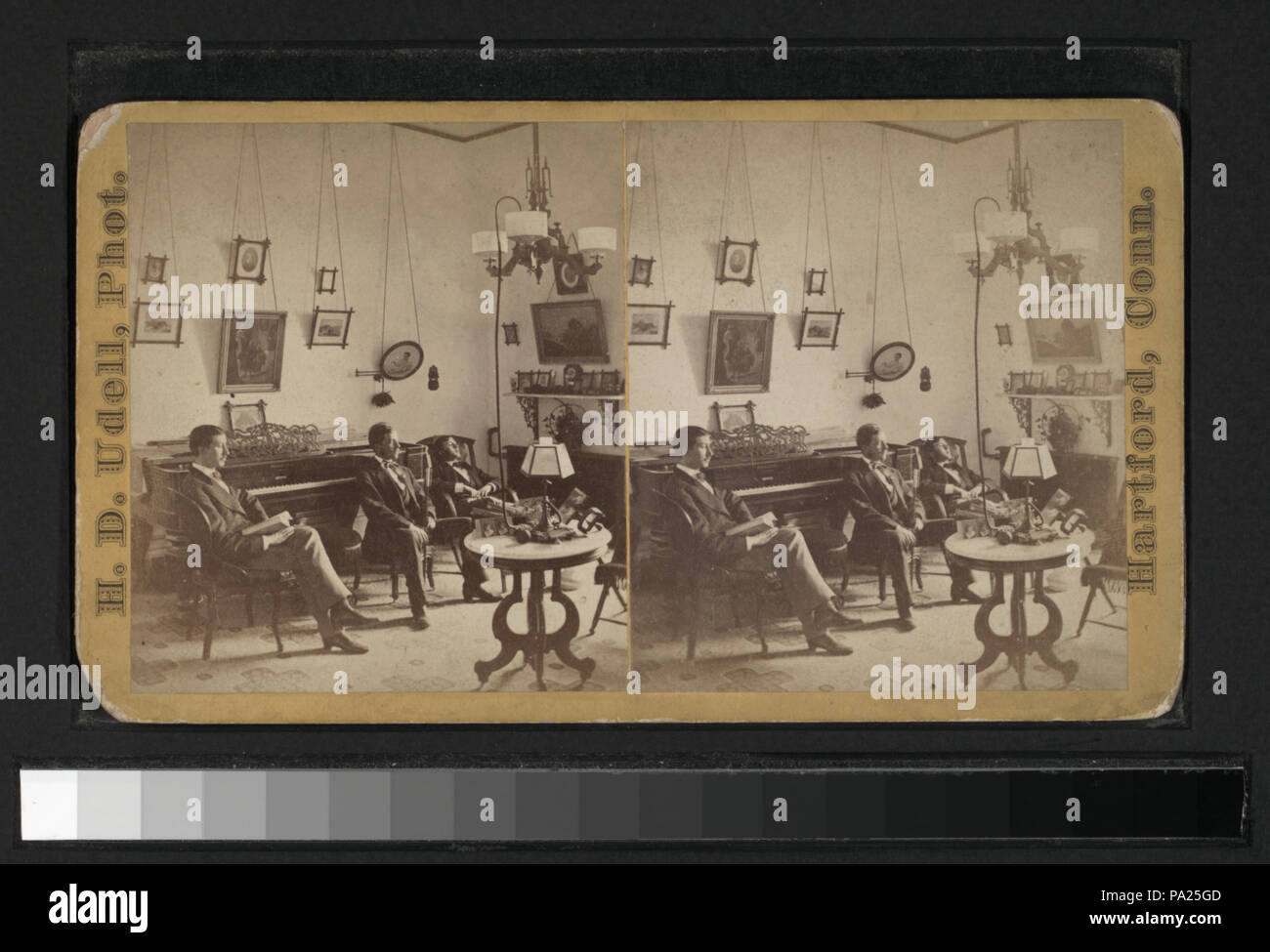 8 (An interior showing 3 men sitting in a parlor with a grand piano ...