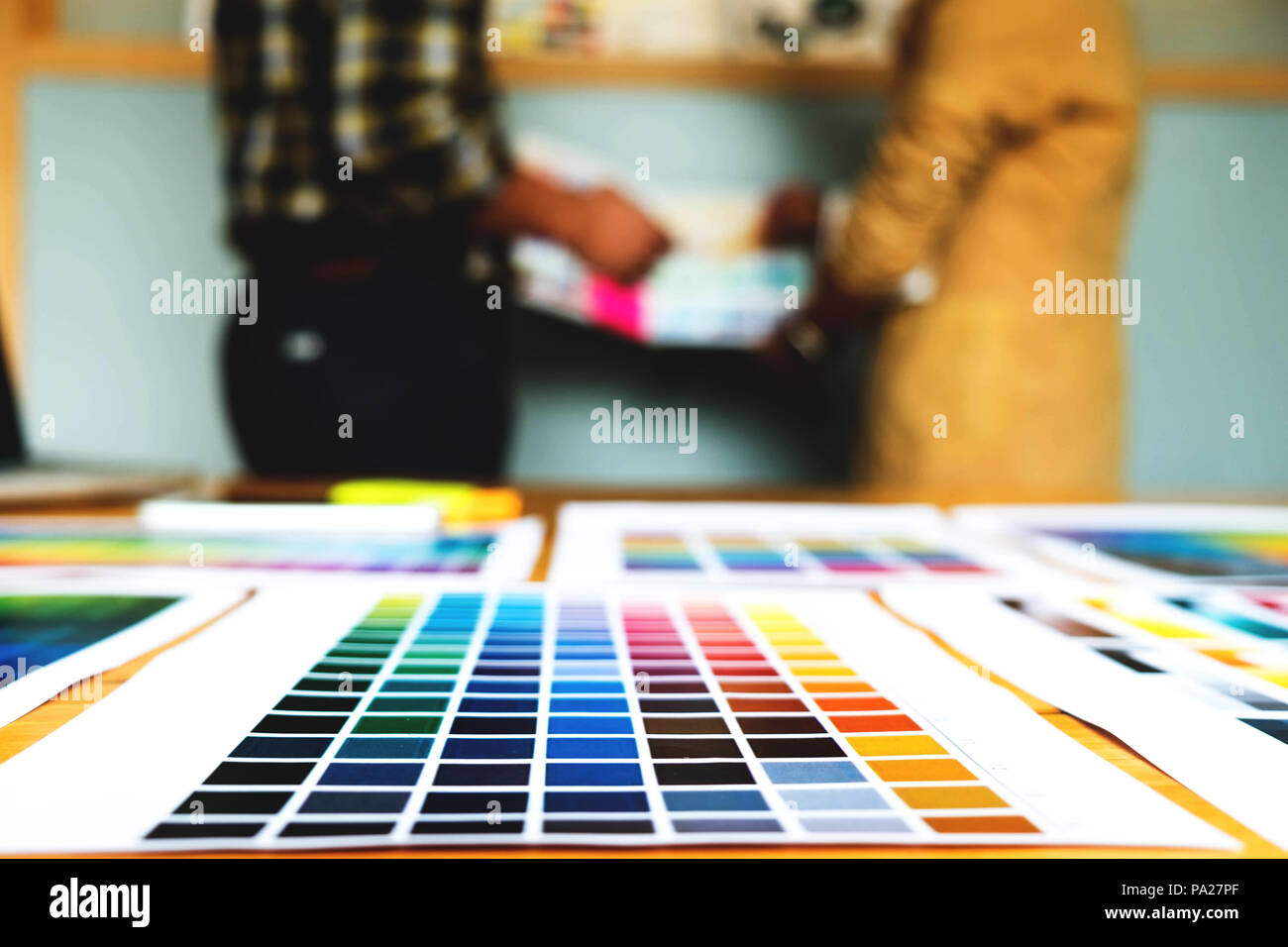 Graphic designers choose colors from the color bands samples for design ...
