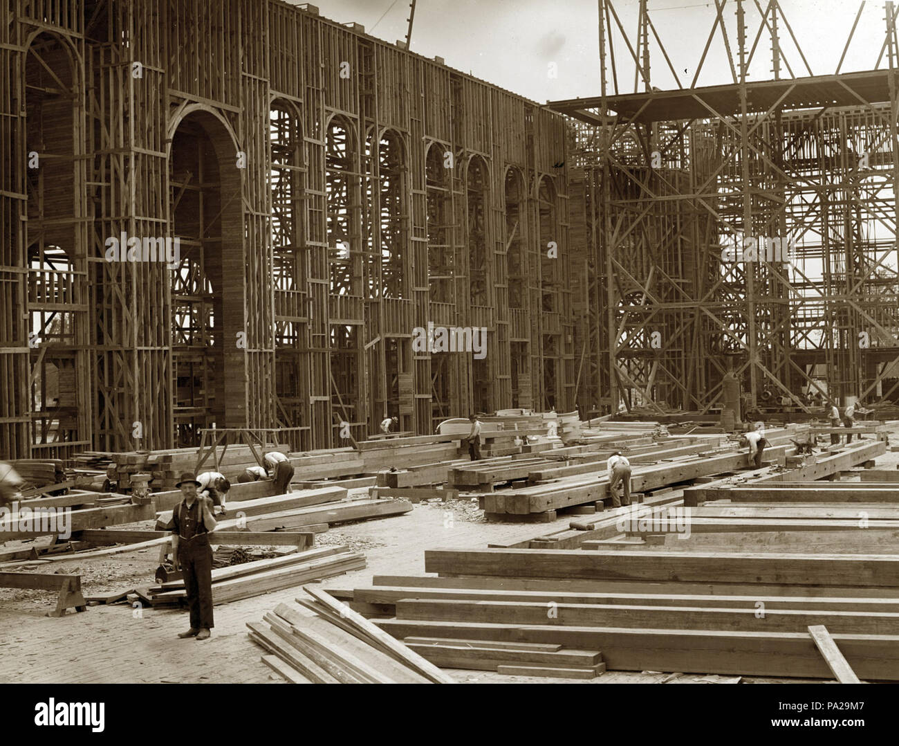 347 Construction workers framing posts and trusses for the Palace of ...