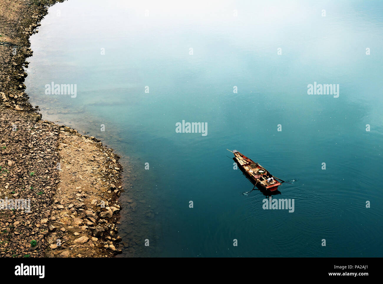 A wooden boat downstream the river for earn-living Stock Photo - Alamy