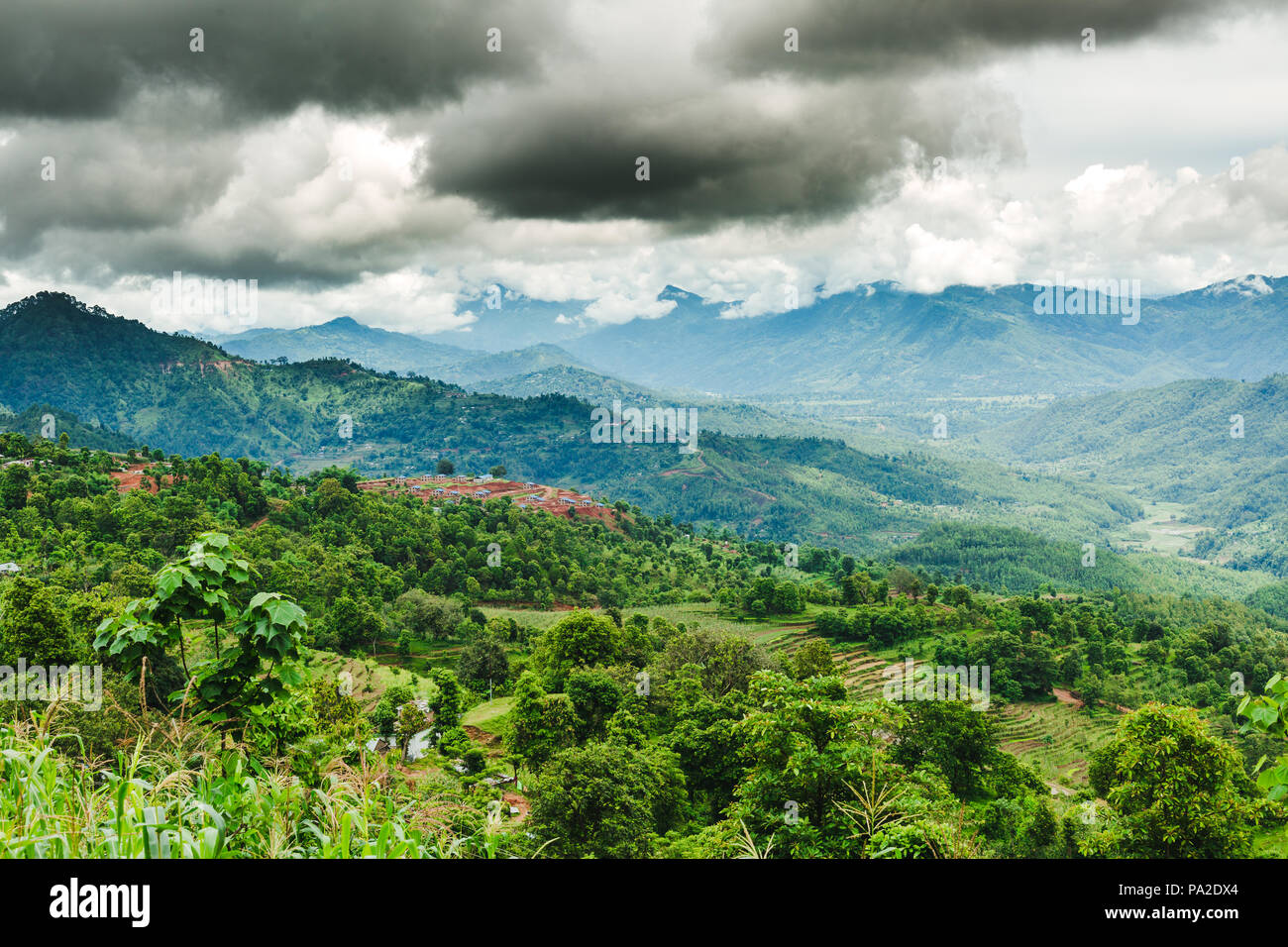Scenery of beautiful Nepali rural village with mountains and green forest.It is in the hilly ...