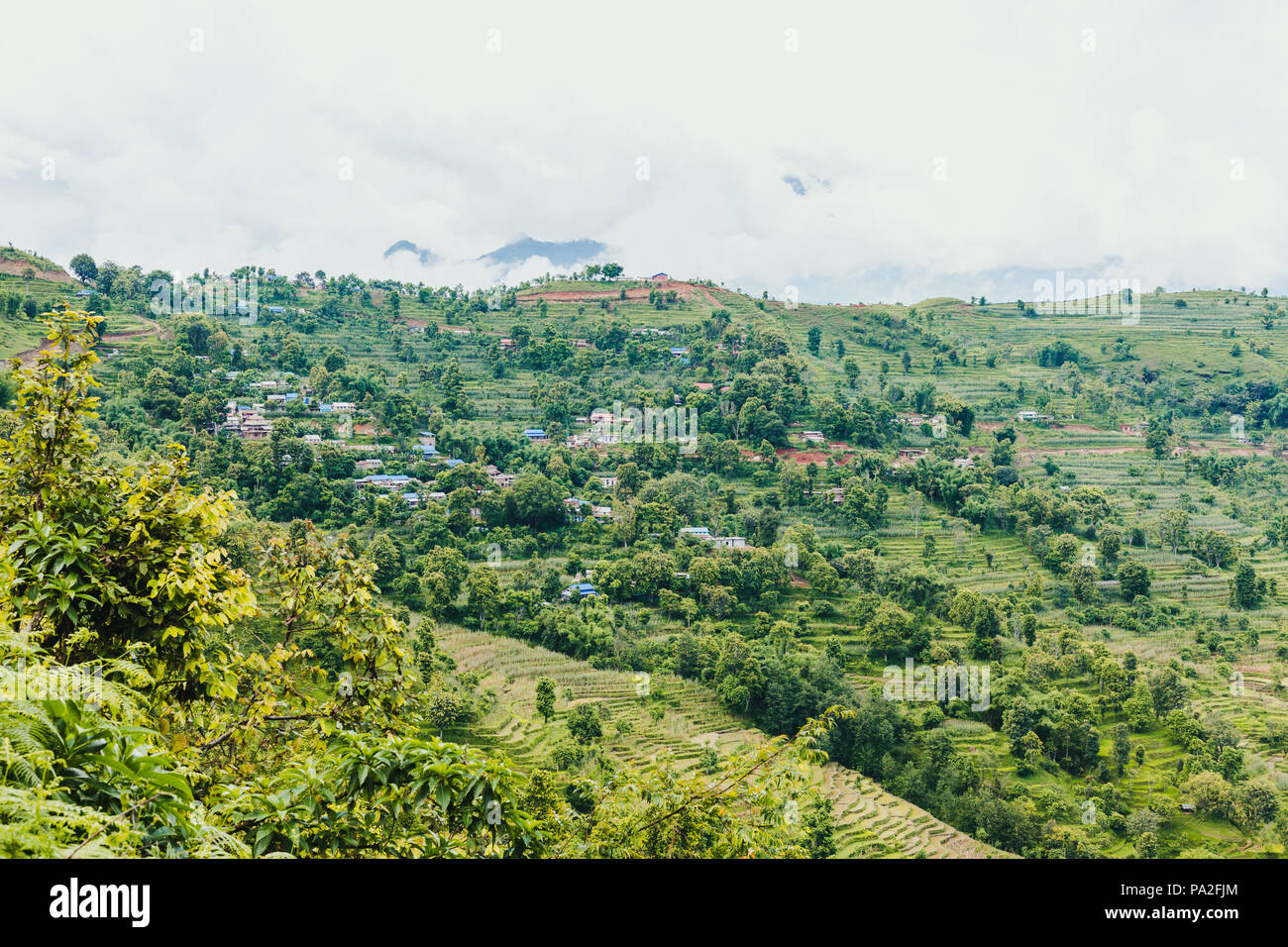 Scenery of beautiful Nepali rural village with mountains and green ...