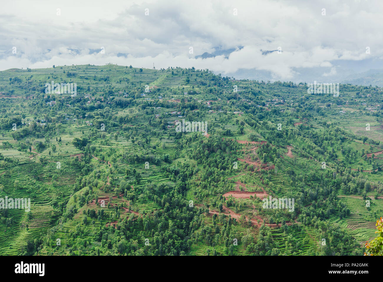 Scenery of beautiful Nepali rural village with mountains and green forest.It is in the hilly ...