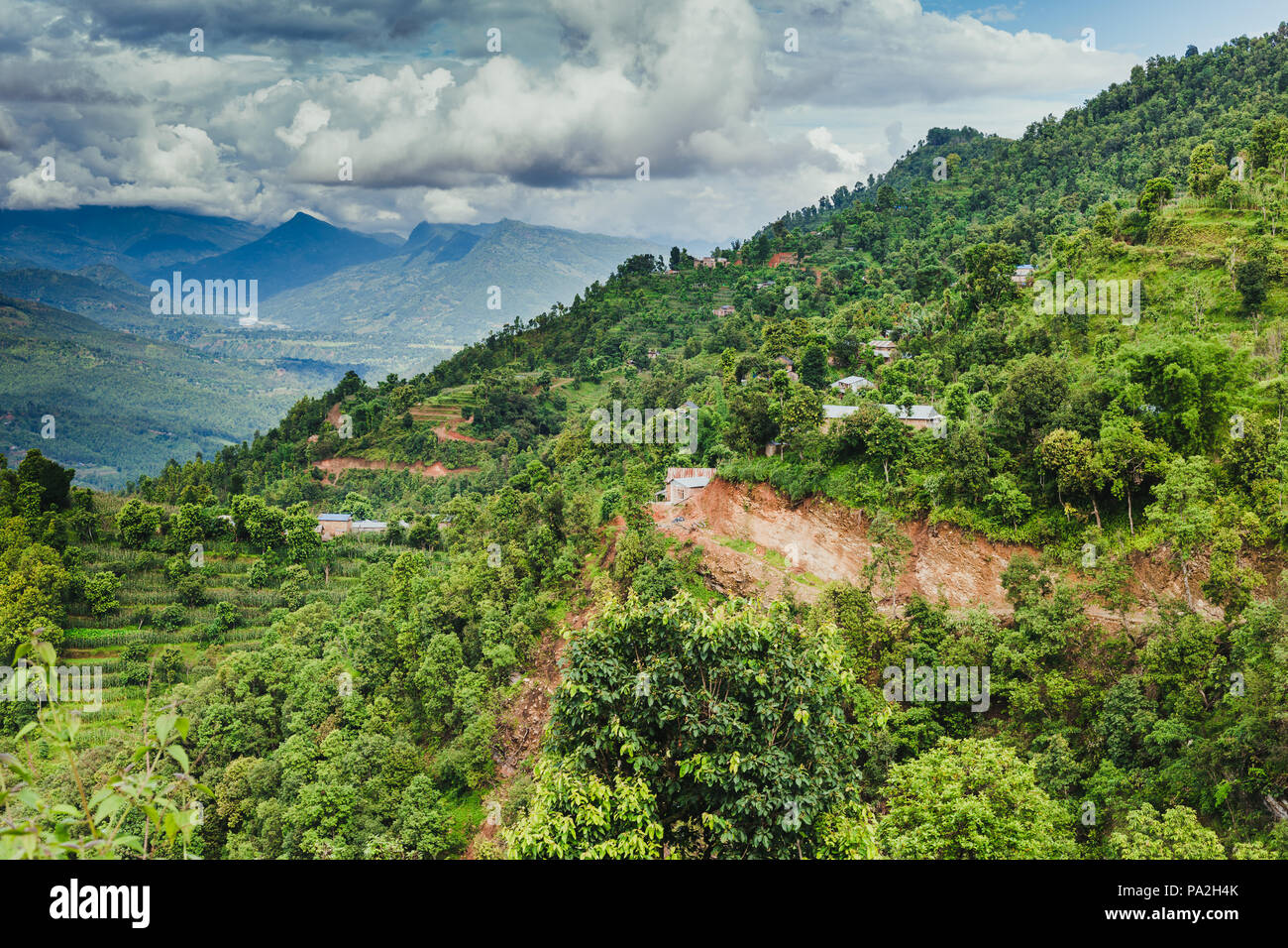 Scenery of beautiful Nepali rural village with mountains and green forest.It is in the hilly ...