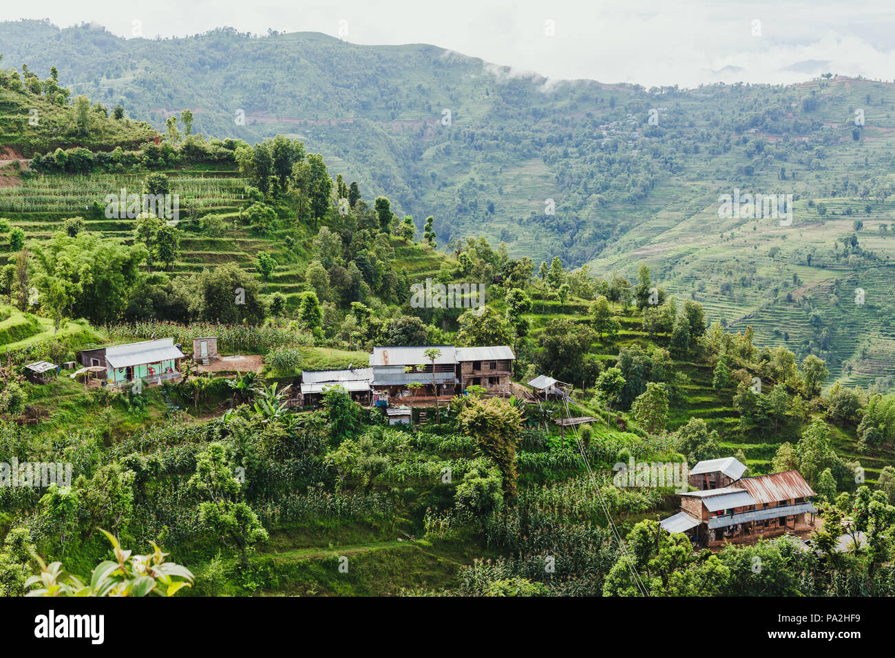 Scenery of beautiful Nepali rural village with mountains and green forest.It is in the hilly ...