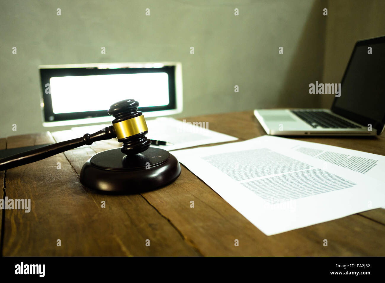 Lawyer desktop , workspace with laptop,gavel,paper and pen on the wood ...